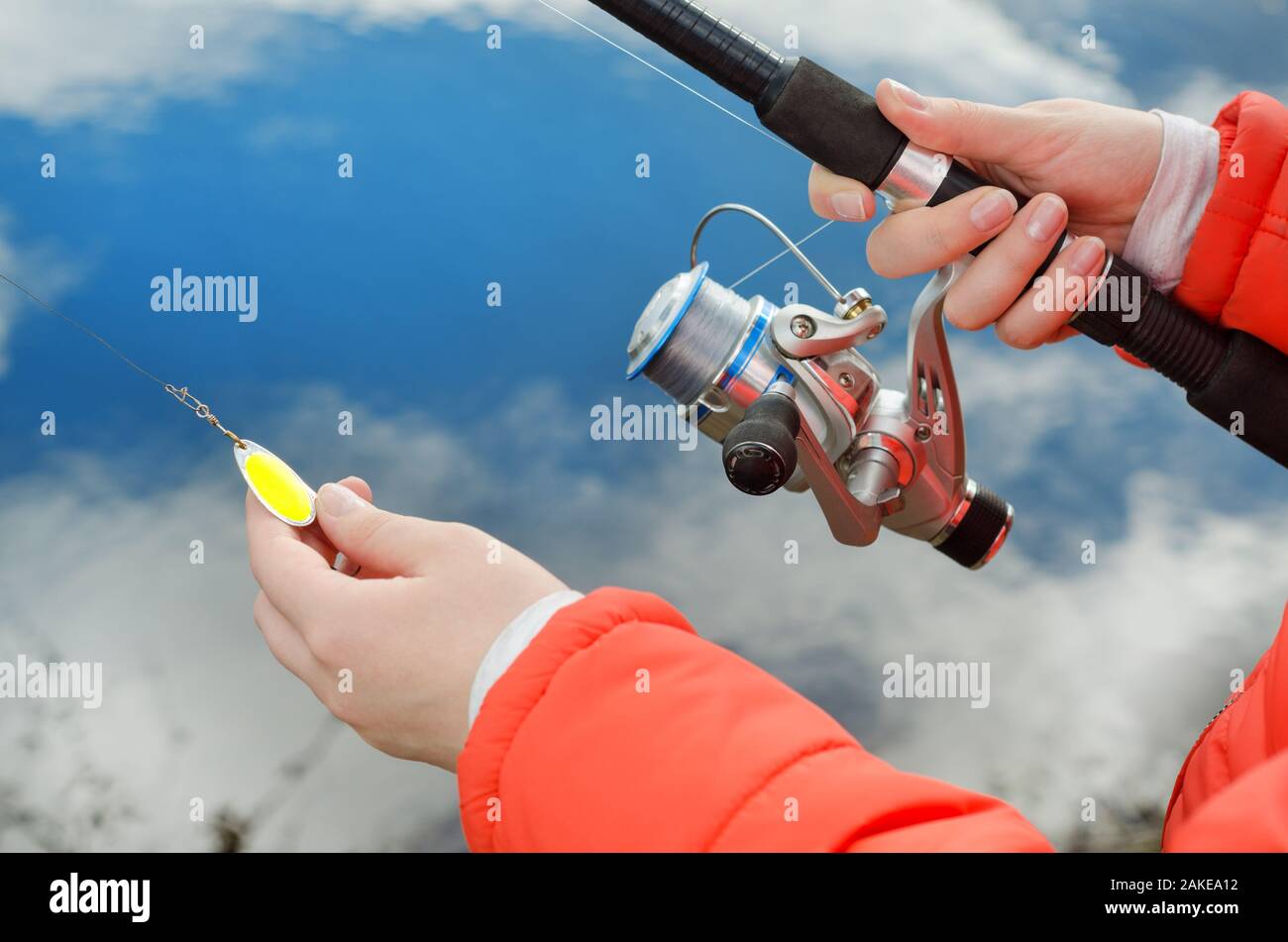 Hands holding a fishing rod hi-res stock photography and images - Alamy