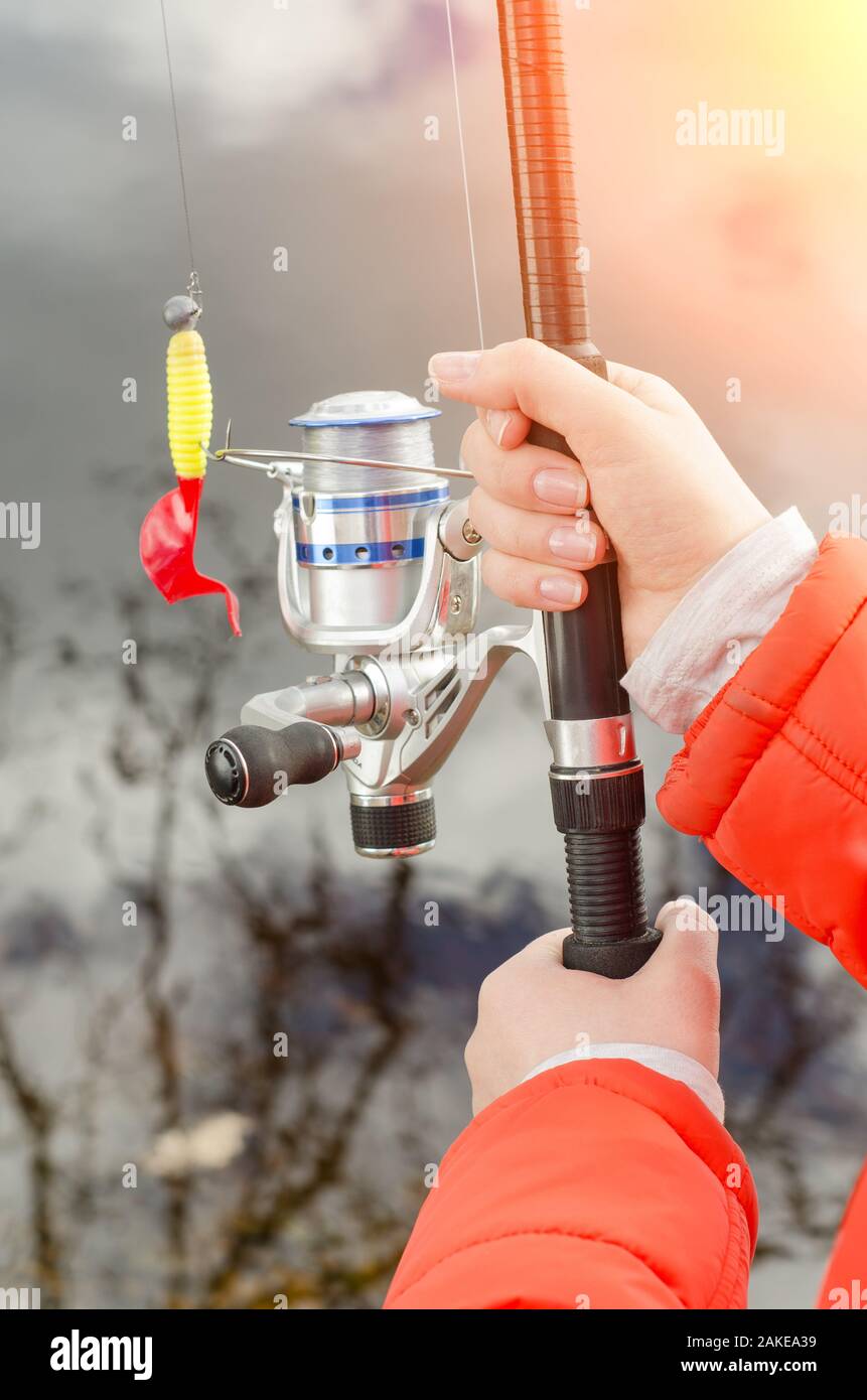 Girl holding fishing pole hi-res stock photography and images - Alamy