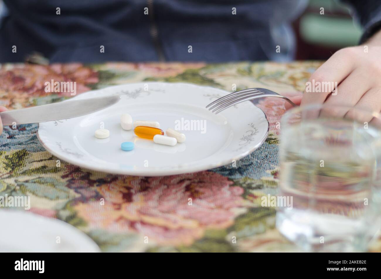 Woman eating drugs tablets hi-res stock photography and images - Alamy