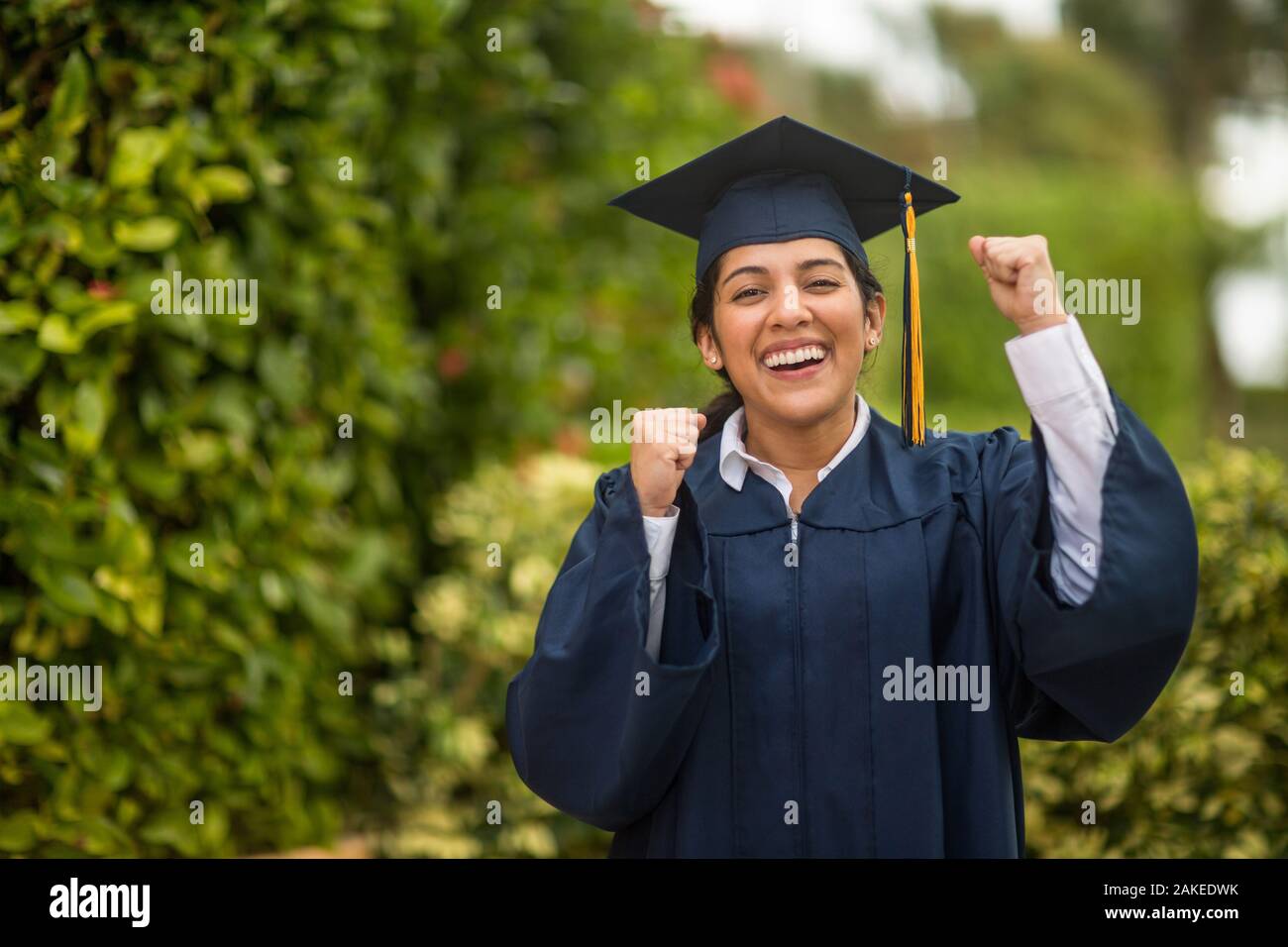 Young hispanic female graduate at her graduation Stock Photo - Alamy