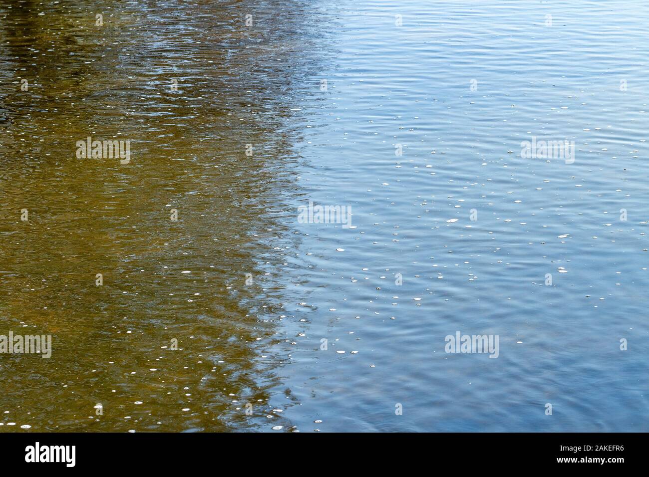 Surface of blue water with reflection Stock Photo - Alamy