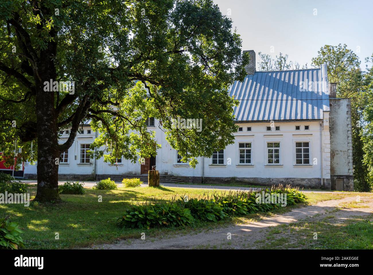 Exterior of old manor house with new blue roof Stock Photo - Alamy