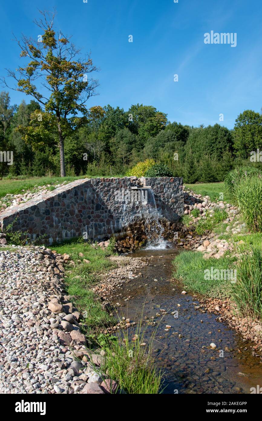 Waterfall of natural source in stone surface Stock Photo - Alamy