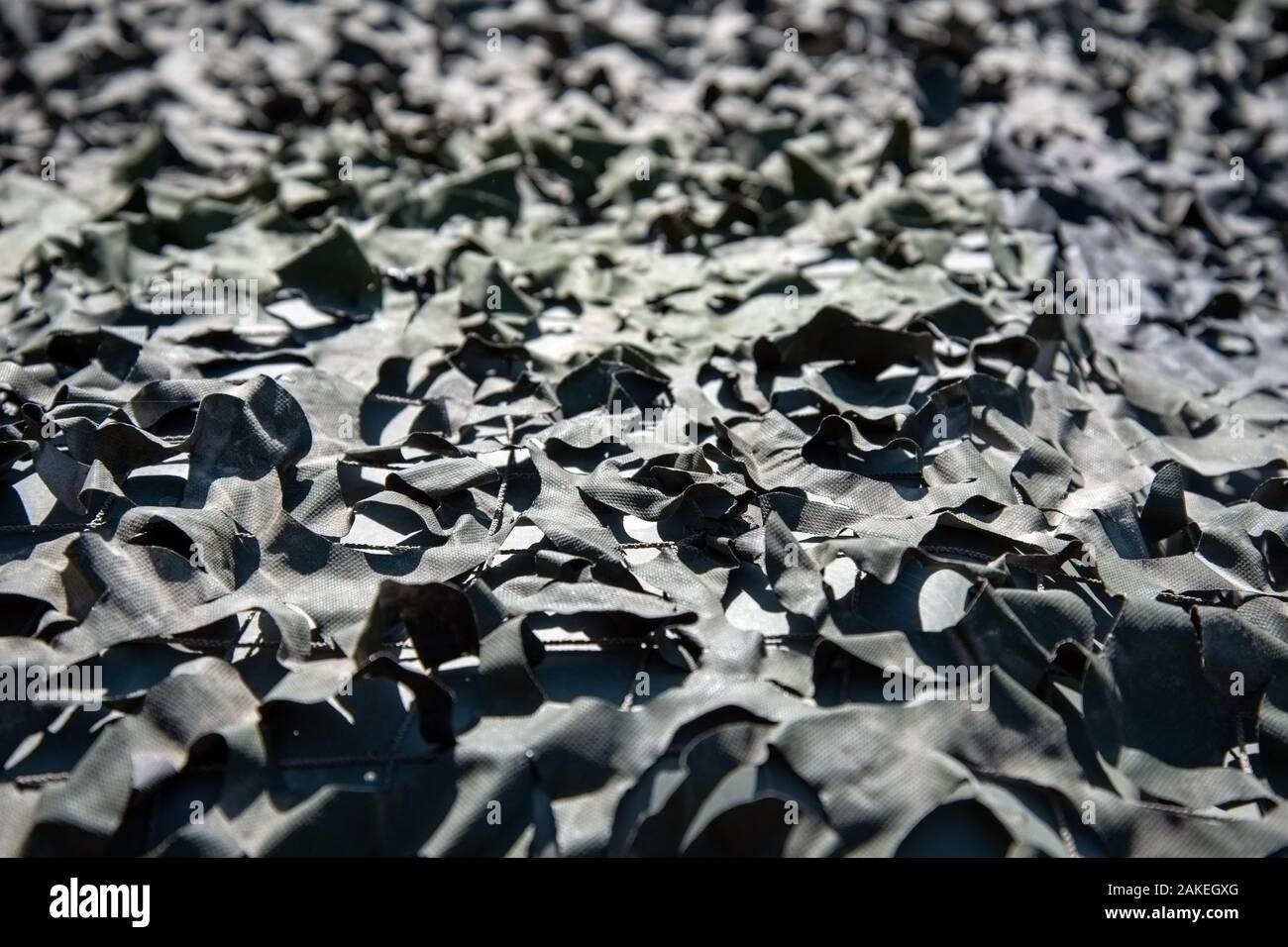 Surface of military masking net Stock Photo - Alamy