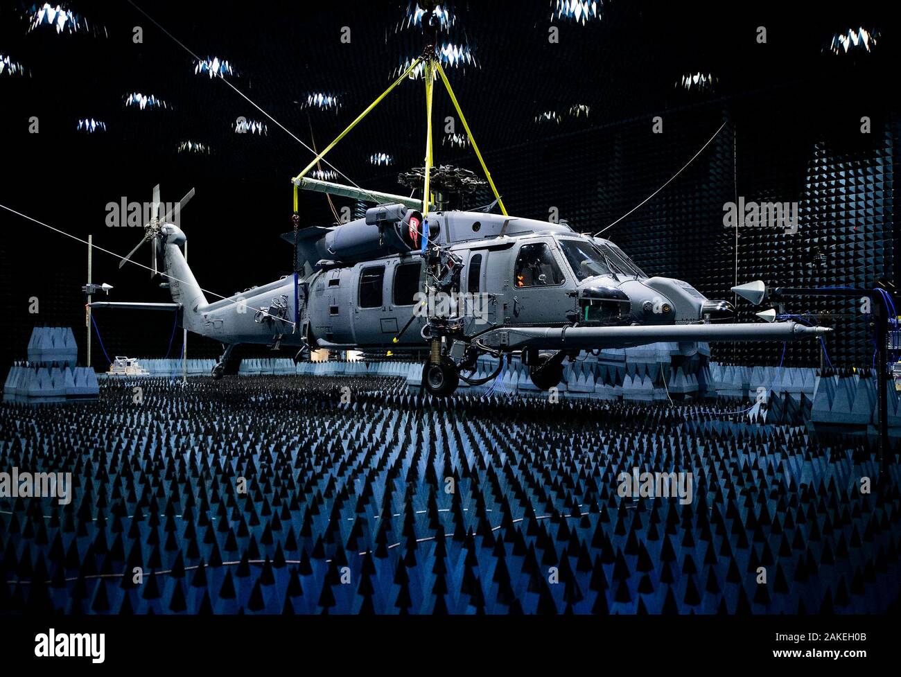 A 413th Flight Test Squadron HH-60W hangs in the anechoic chamber at ...