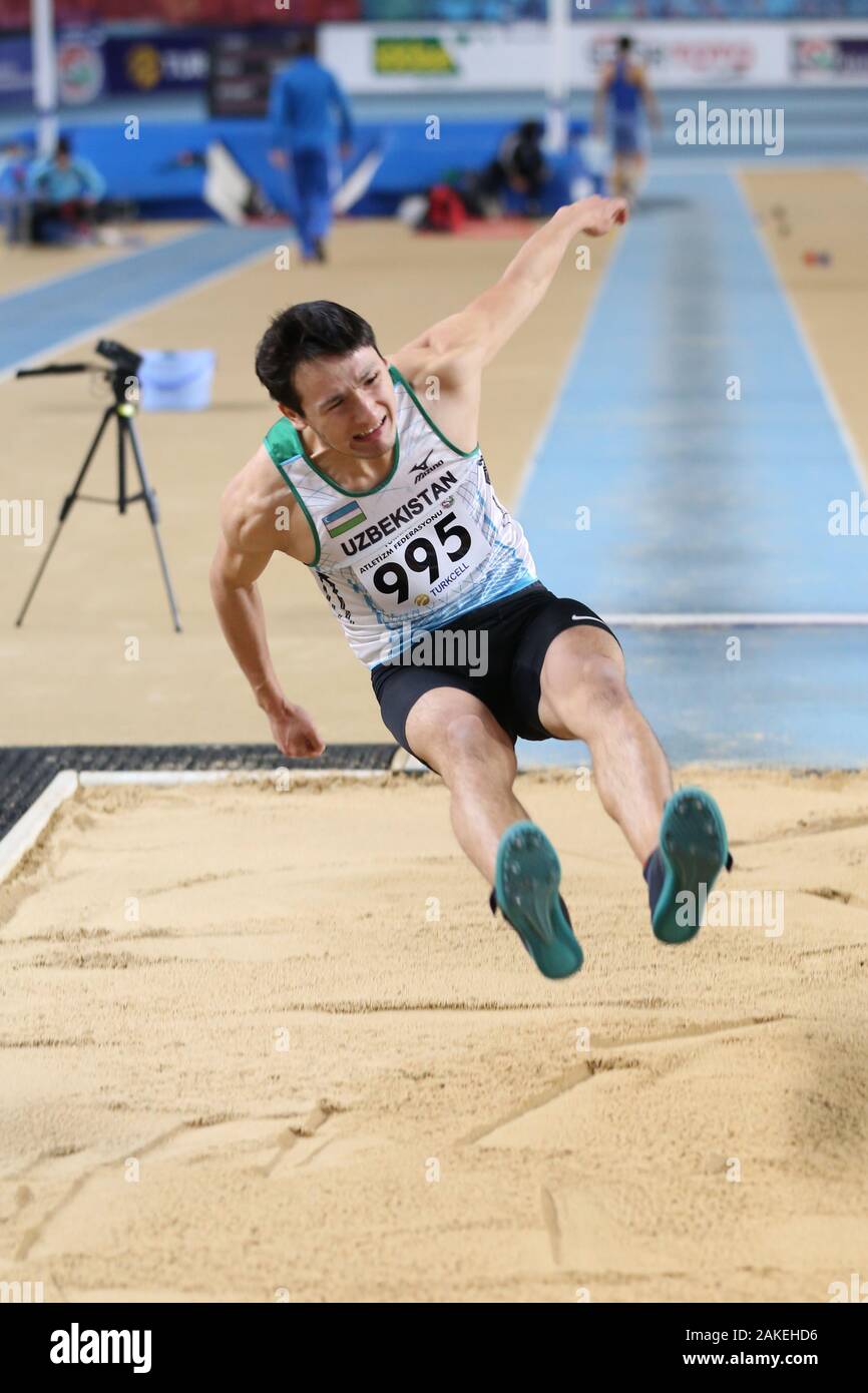 ISTANBUL, TURKEY - DECEMBER 28, 2019: Undefined athlete long jumping ...