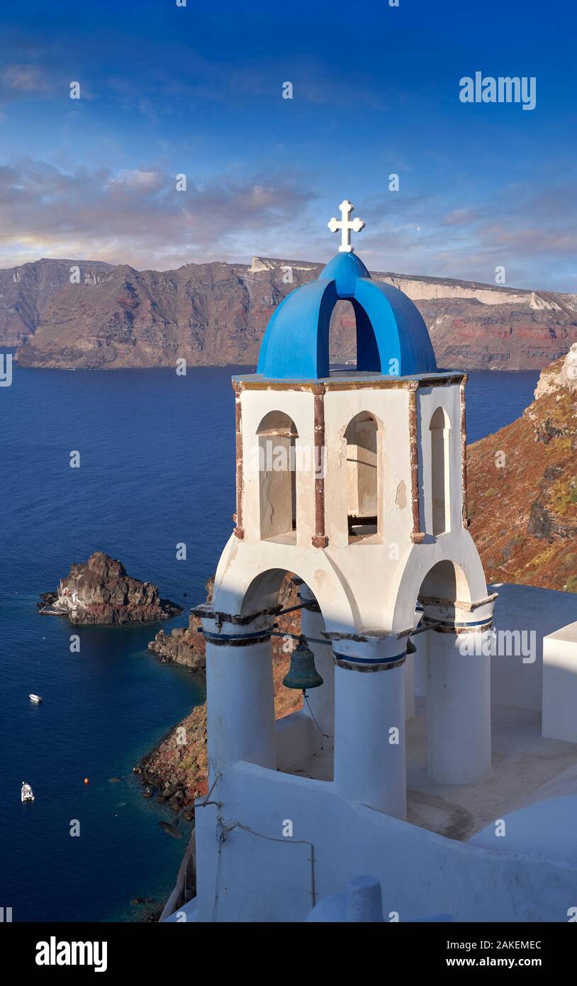 Bell tower of traditional blue domed Greek Orthodox church of Oia ...