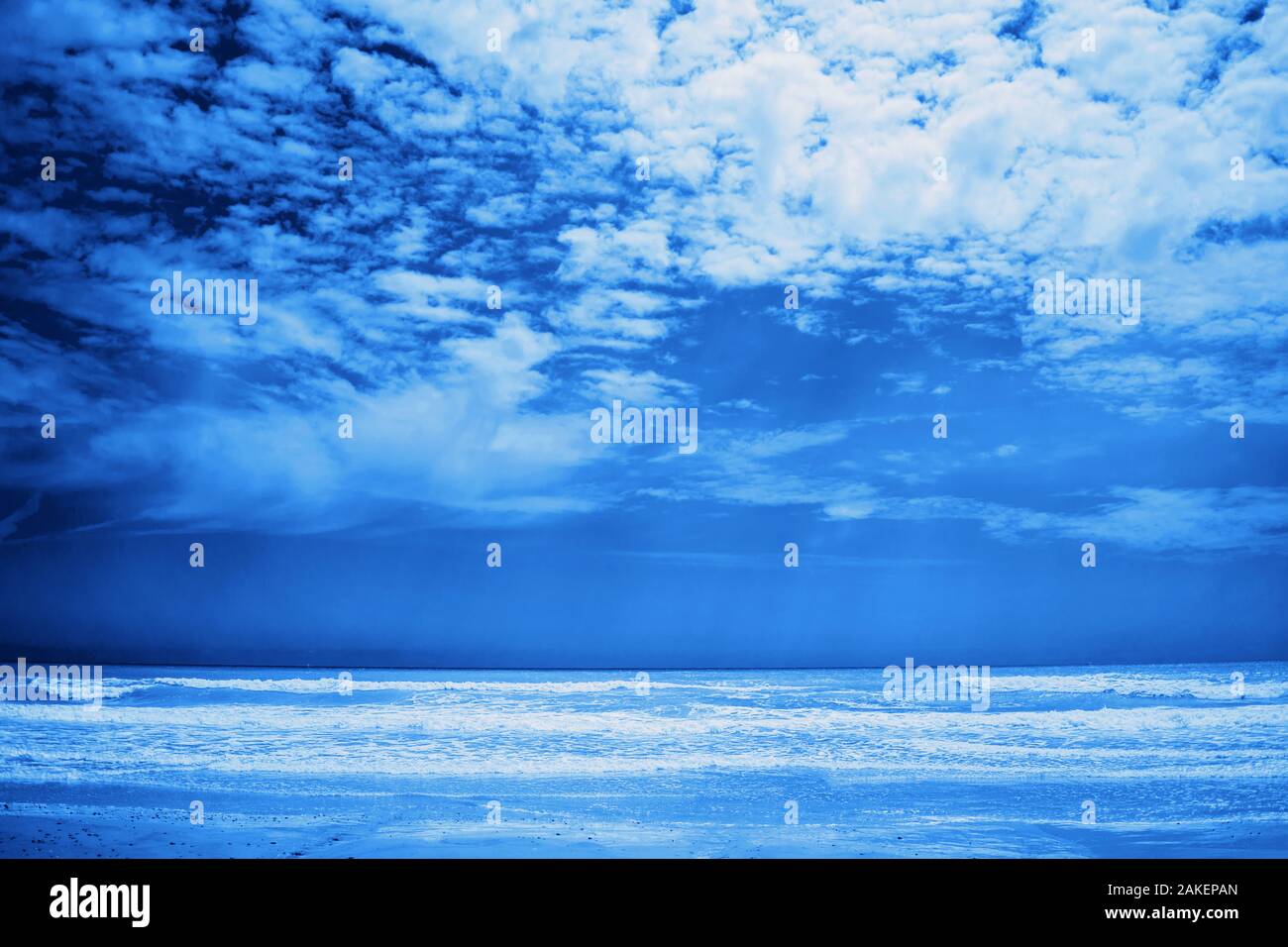 View of the blue expanse of the sea and the blue sky with clouds. Great ...
