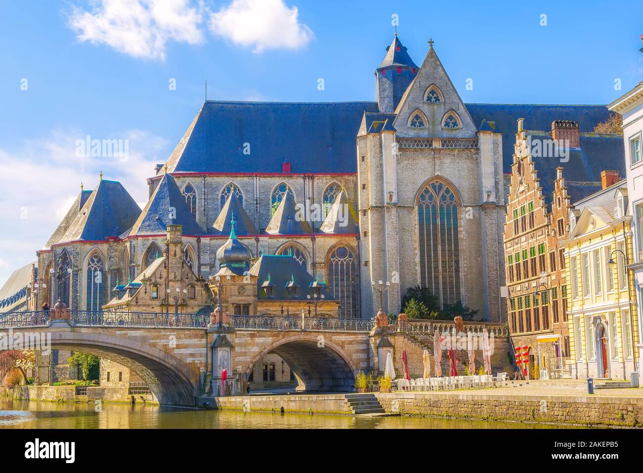 Medieval cathedral and bridge over a canal in Ghent or Gent, Belgium ...