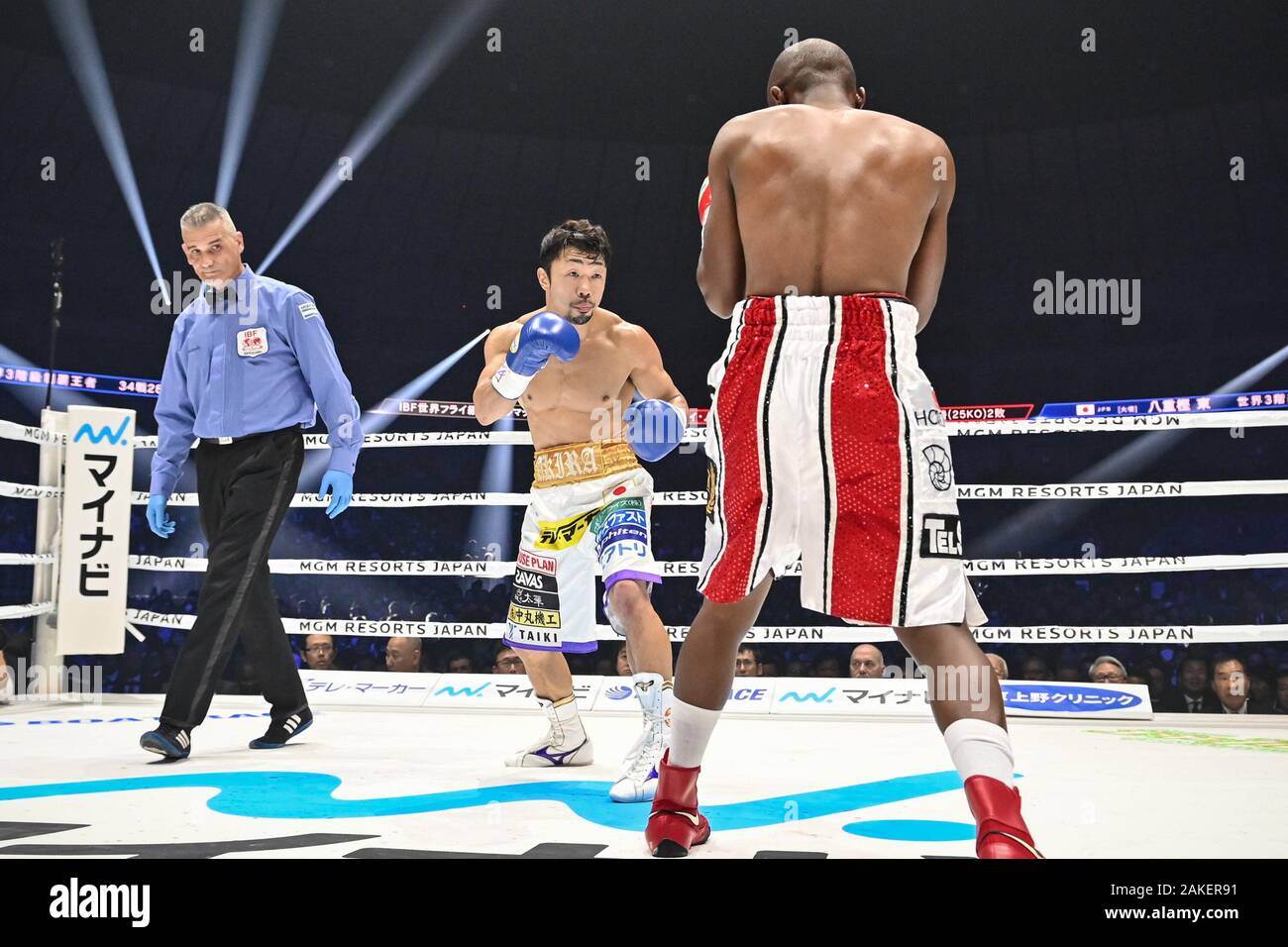 Japan's Akira Yaegashi (C) and South Africa's Moruti Mthalane fight at ...