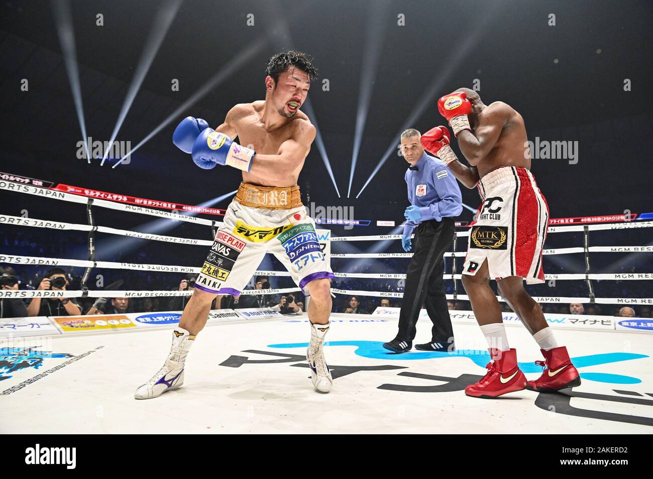 Japan's Akira Yaegashi (L) and South Africa's Moruti Mthalane fight at ...