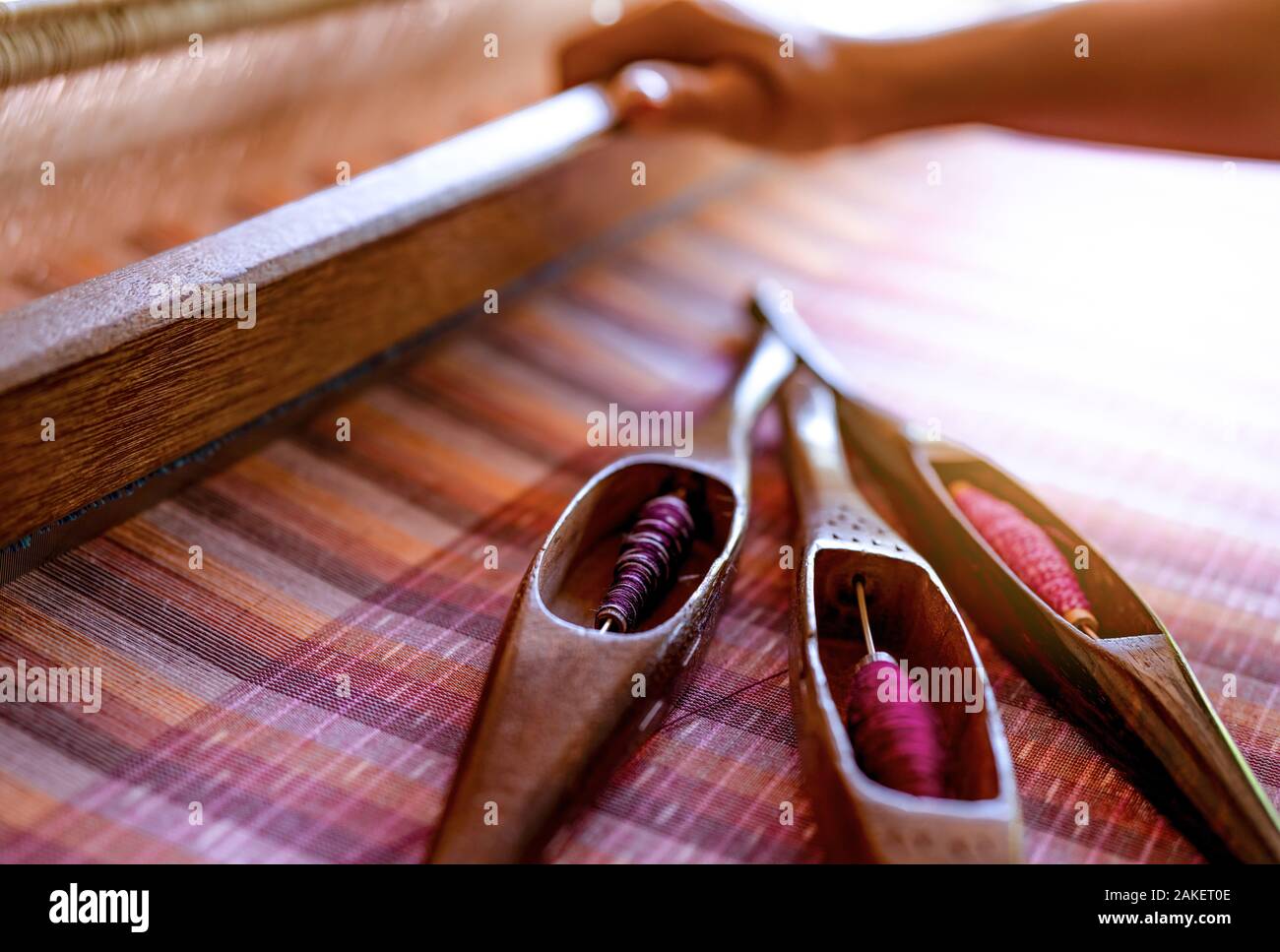 Woman working on weaving machine for weave handmade fabric. Textile ...