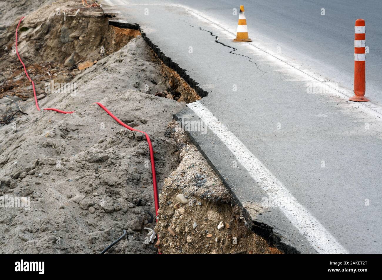 Broken edge of the road with a split Stock Photo - Alamy
