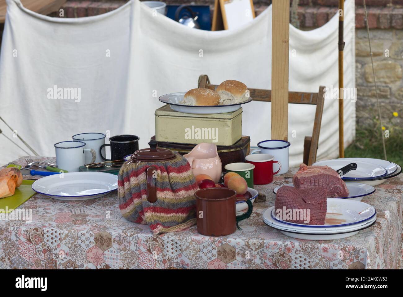 world war 11, Table set for Sunday dinner beef and bread and tea, field ...