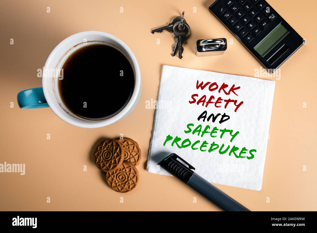 Work Safety and Safety Procedures. Text on a napkin with a cup of ...
