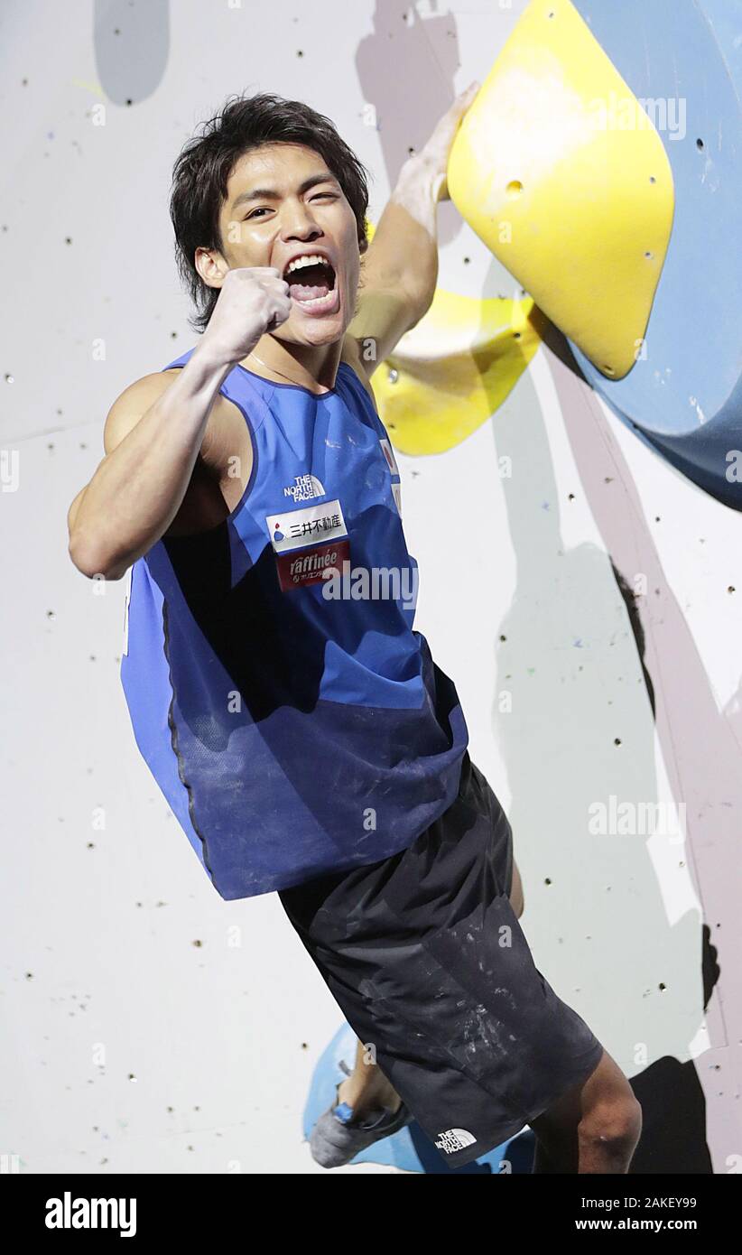 Tomoa Narasaki of Japan celebrates after completing a problem in the ...