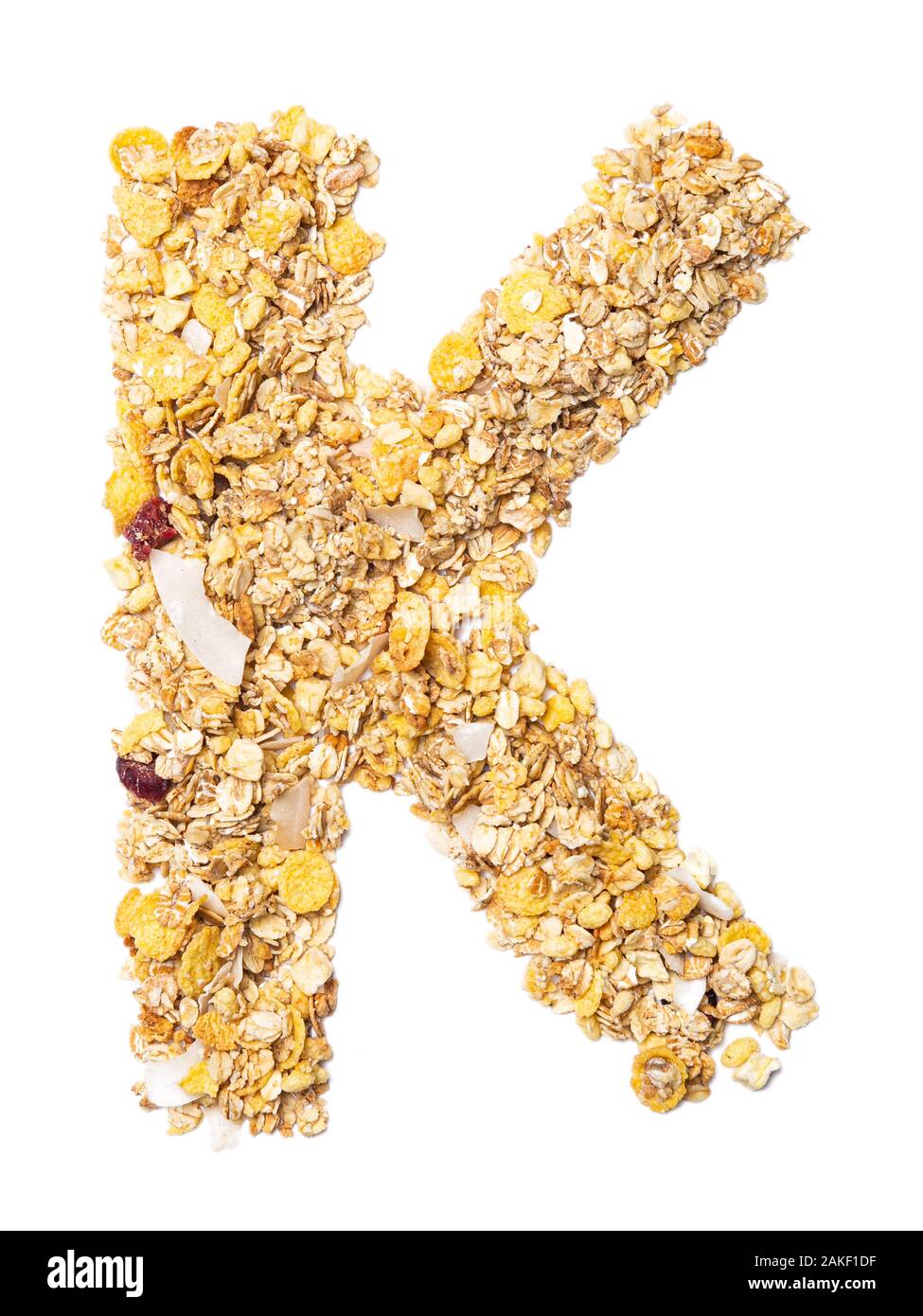Letter K of the English alphabet muesli with coconut, berries, raisins ...