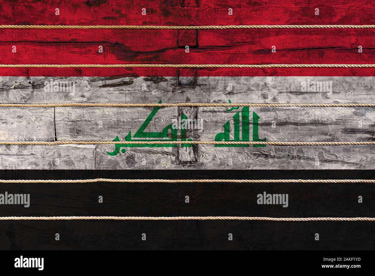 National flag of Irak on a wooden wall background. The concept of ...