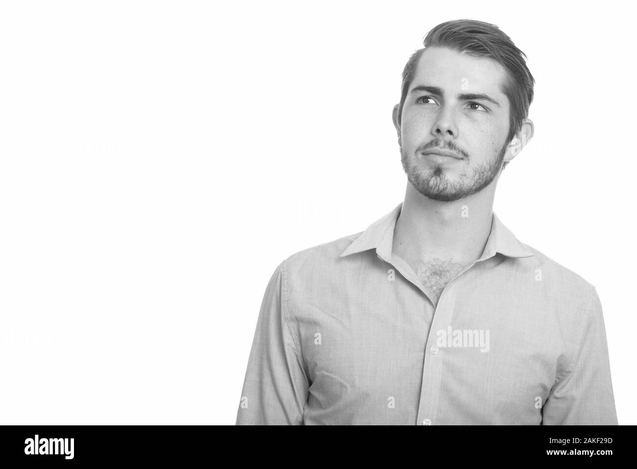 Portrait of young handsome bearded man in black and white Stock Photo ...