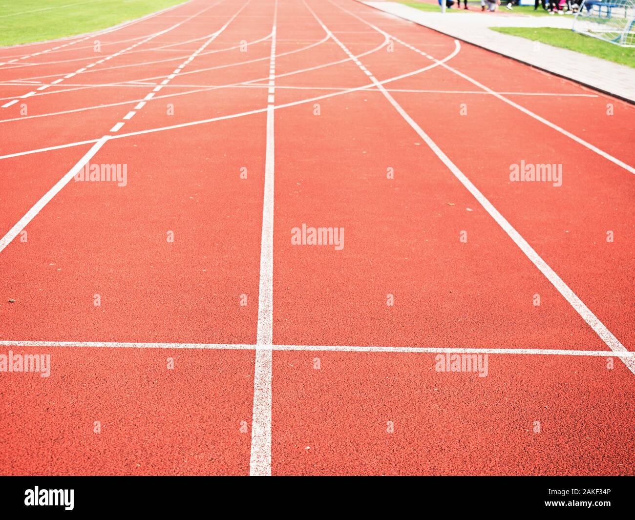 Empty running track for the background with white lines Stock Photo - Alamy