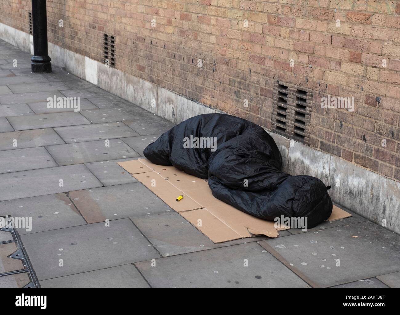 A Rough Sleeper on a pavement in London Stock Photo - Alamy