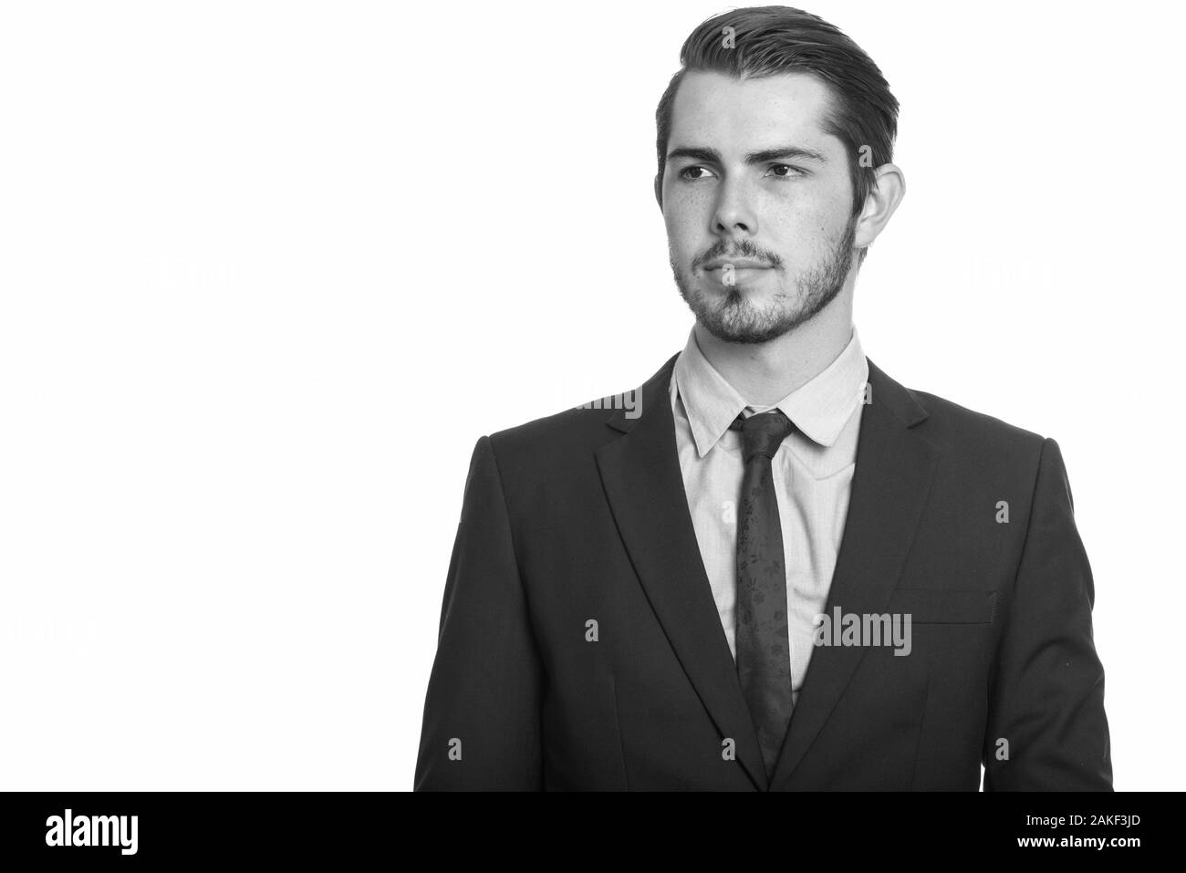 Portrait of young handsome bearded man in black and white Stock Photo ...