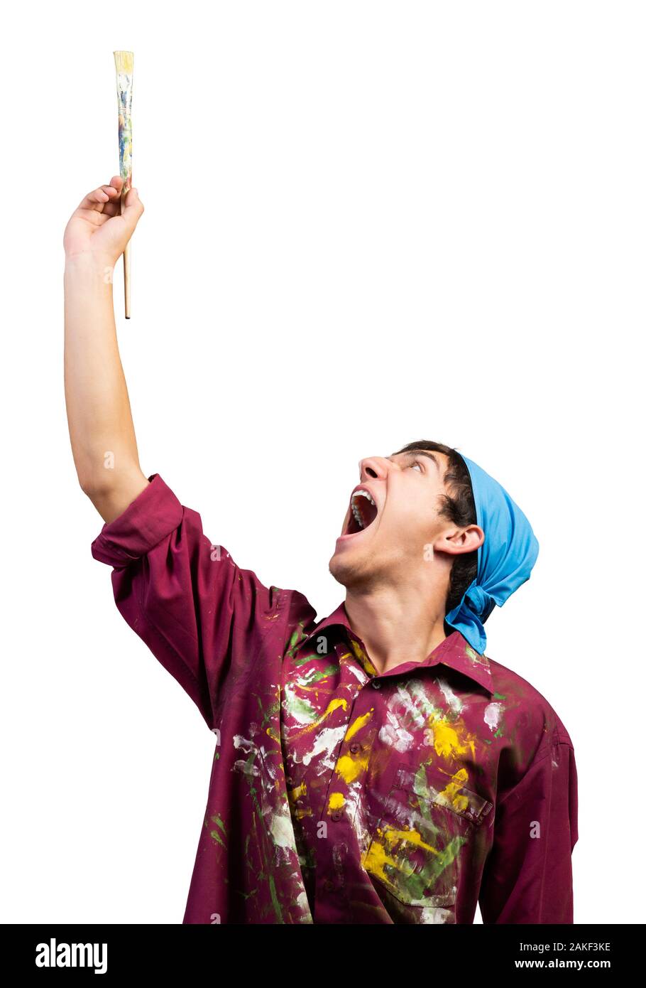 Smiling young painter artist pointing upwards Stock Photo - Alamy