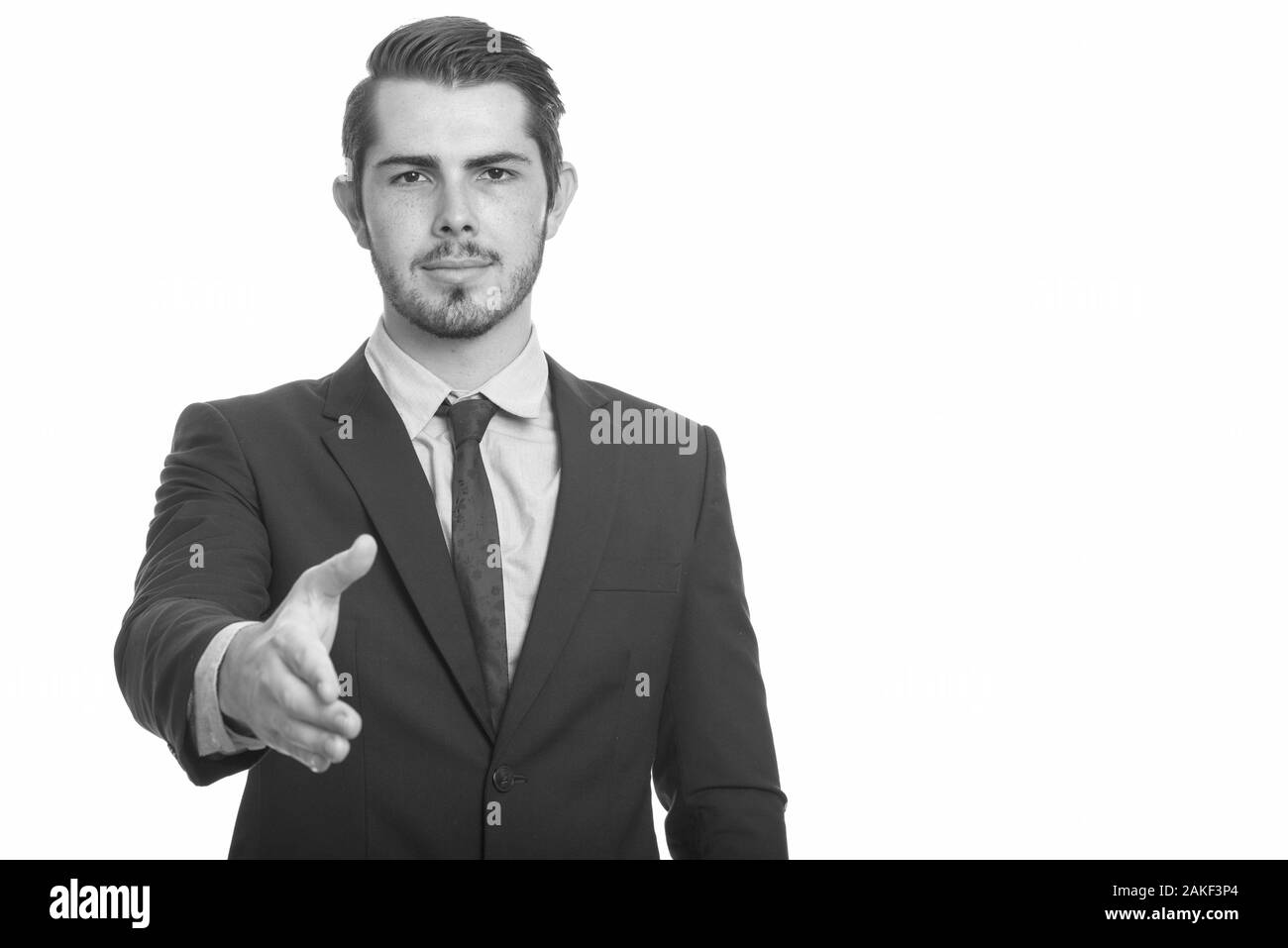 Portrait of young handsome bearded man in black and white Stock Photo ...