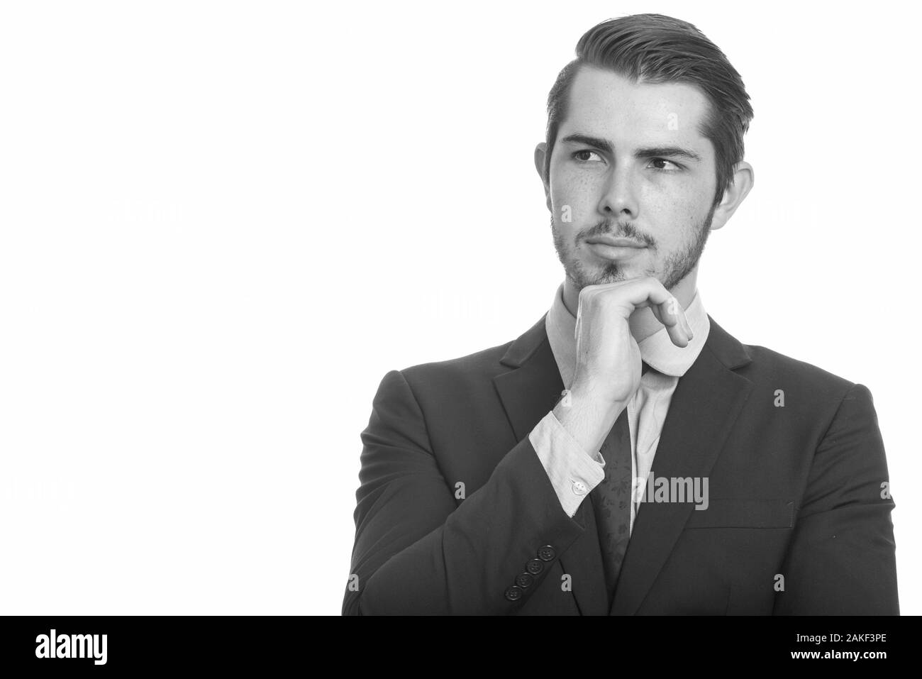 Portrait of young handsome bearded man in black and white Stock Photo ...