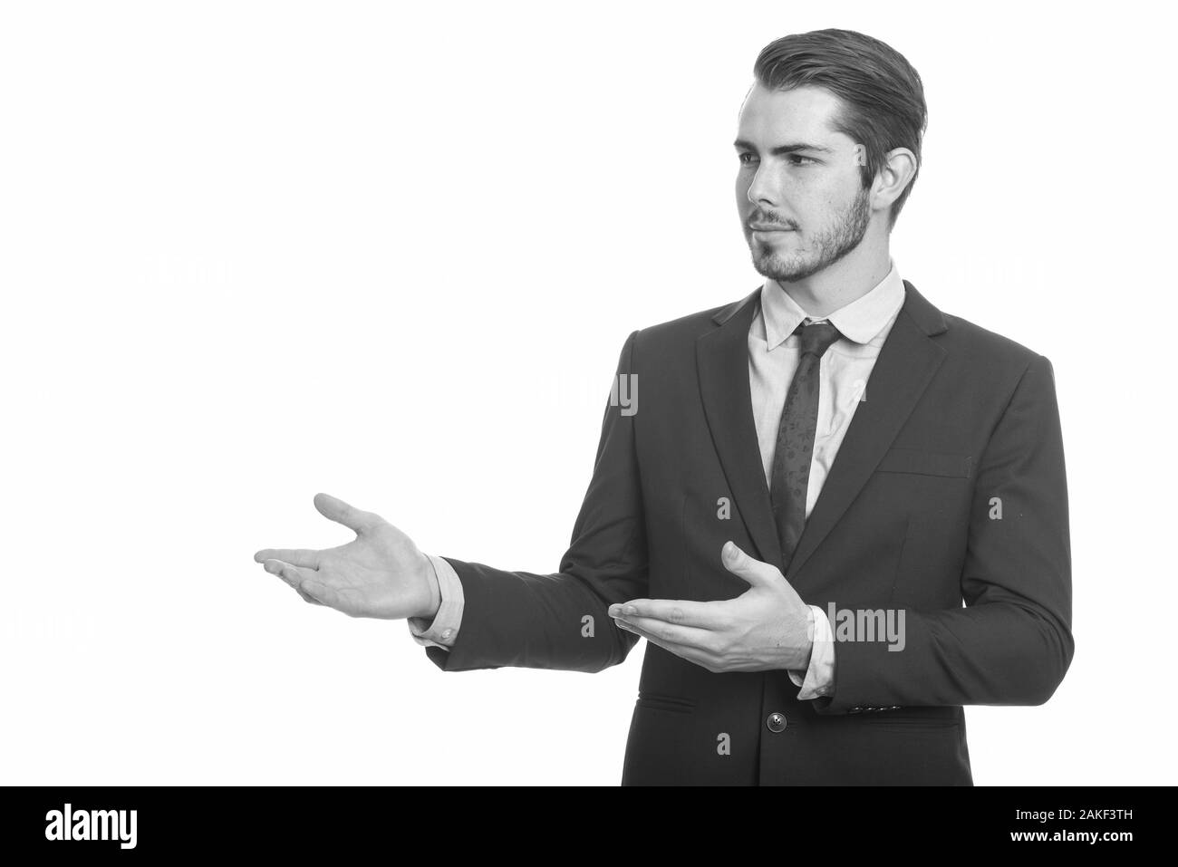 Portrait of young handsome bearded man in black and white Stock Photo ...