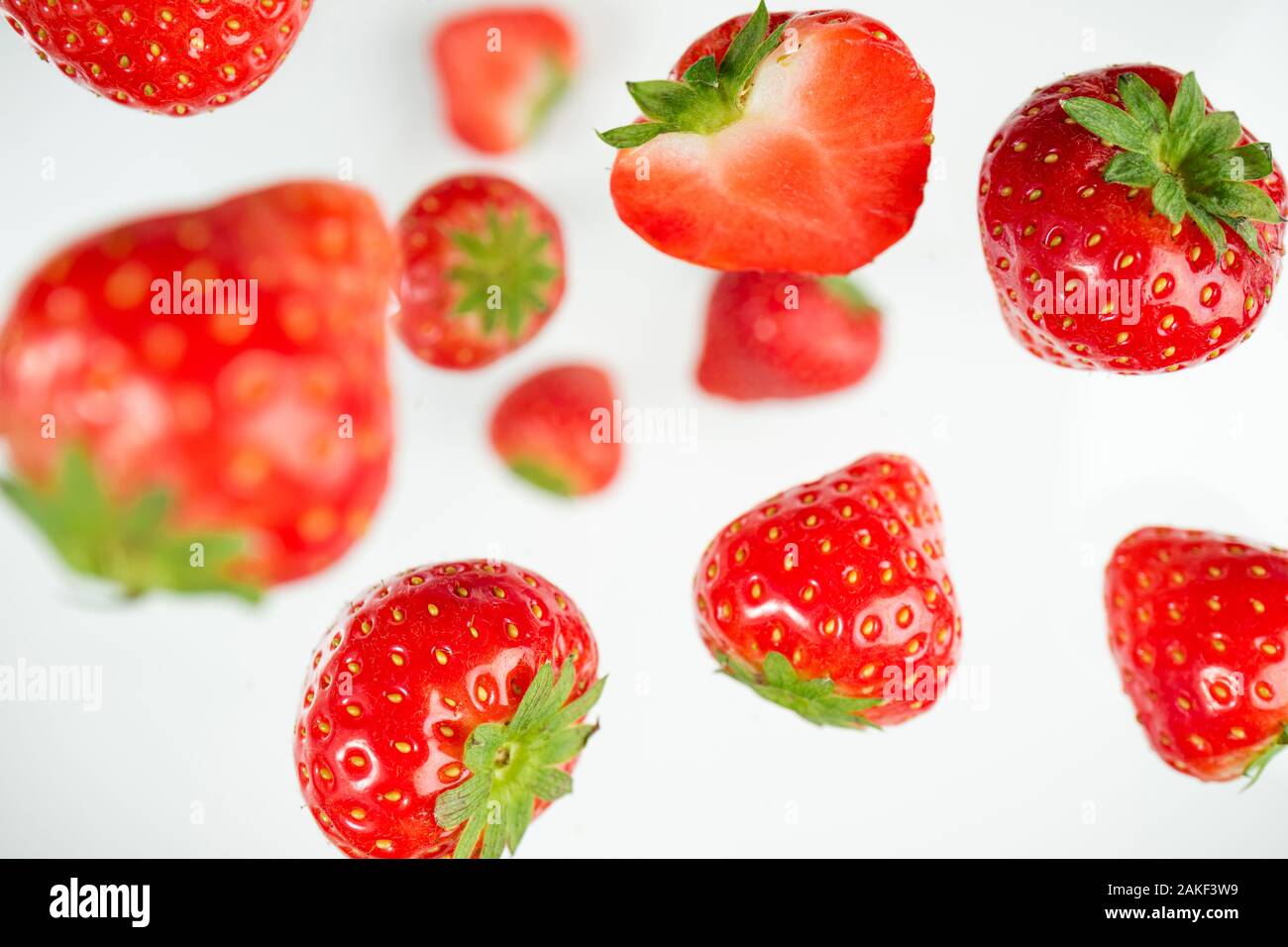 Falling berries strawberry on white background. Flying berries pattern ...