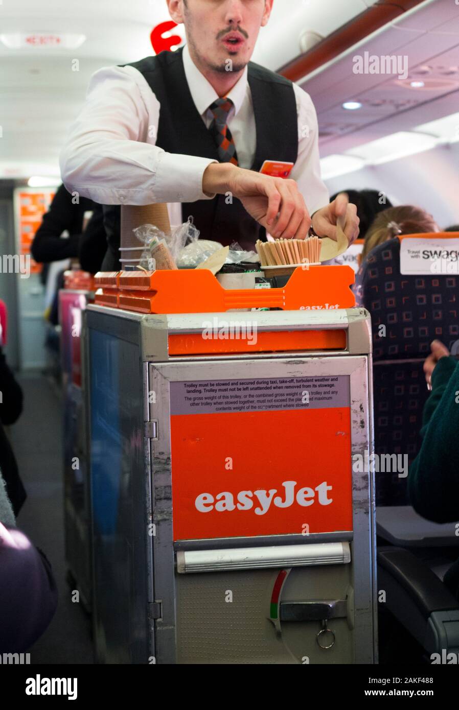 Male flight attendant snacks hi-res stock photography and images - Alamy