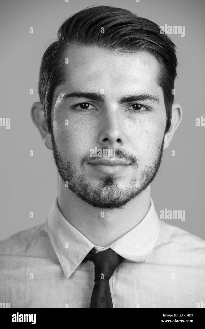 Portrait of young handsome bearded man in black and white Stock Photo ...
