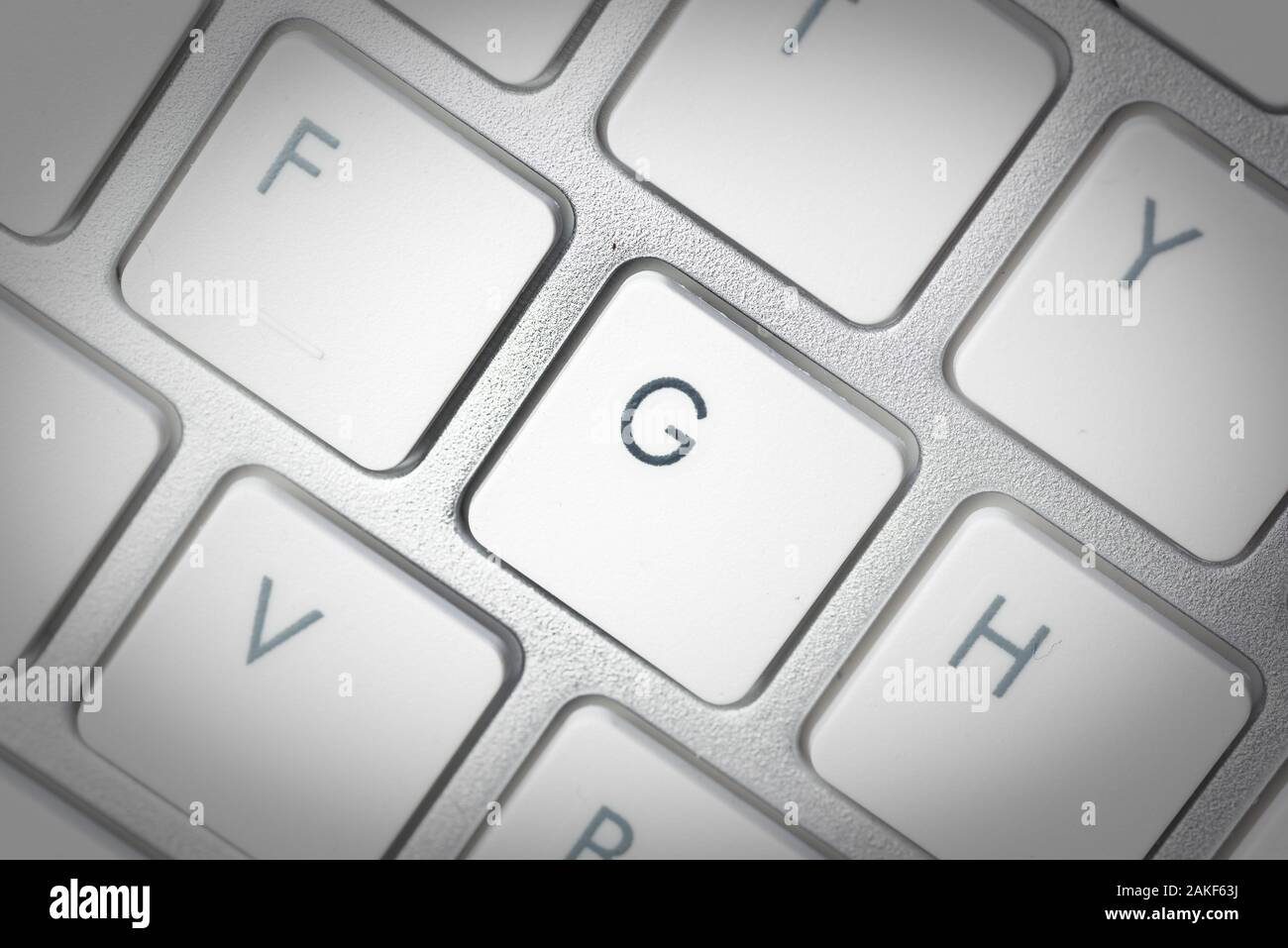 Computer keyboard - silver keyboard of a laptop with button G isolated ...