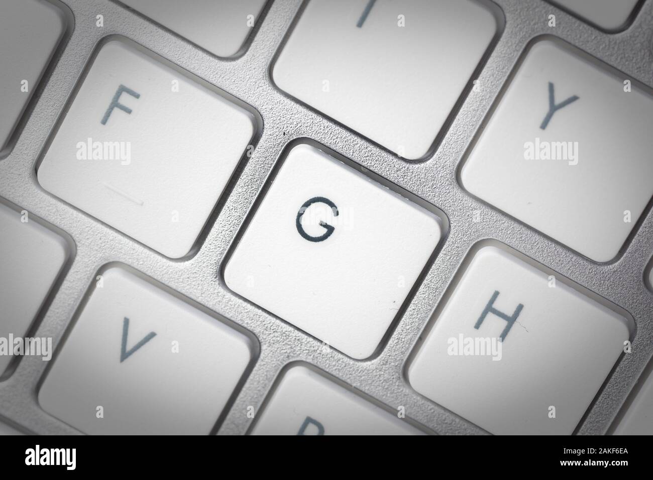 Computer keyboard - silver keyboard of a laptop with button G isolated ...
