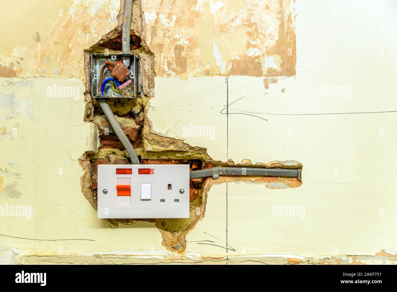electric socket in a wall during renovation in england uk Stock Photo ...