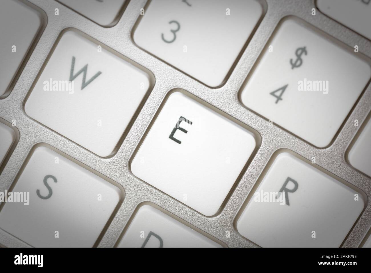 Computer keyboard - silver keyboard of a laptop with button E isolated ...
