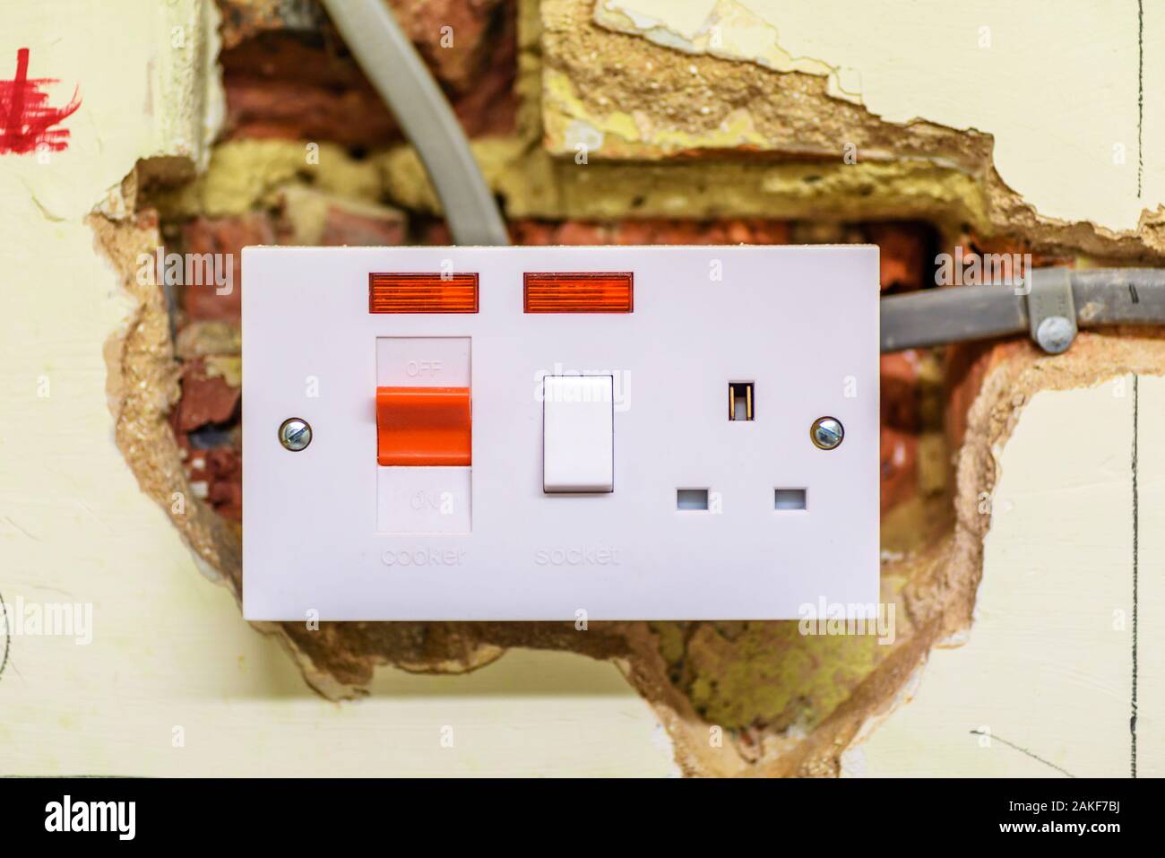 electric socket in a wall during renovation in england uk Stock Photo ...