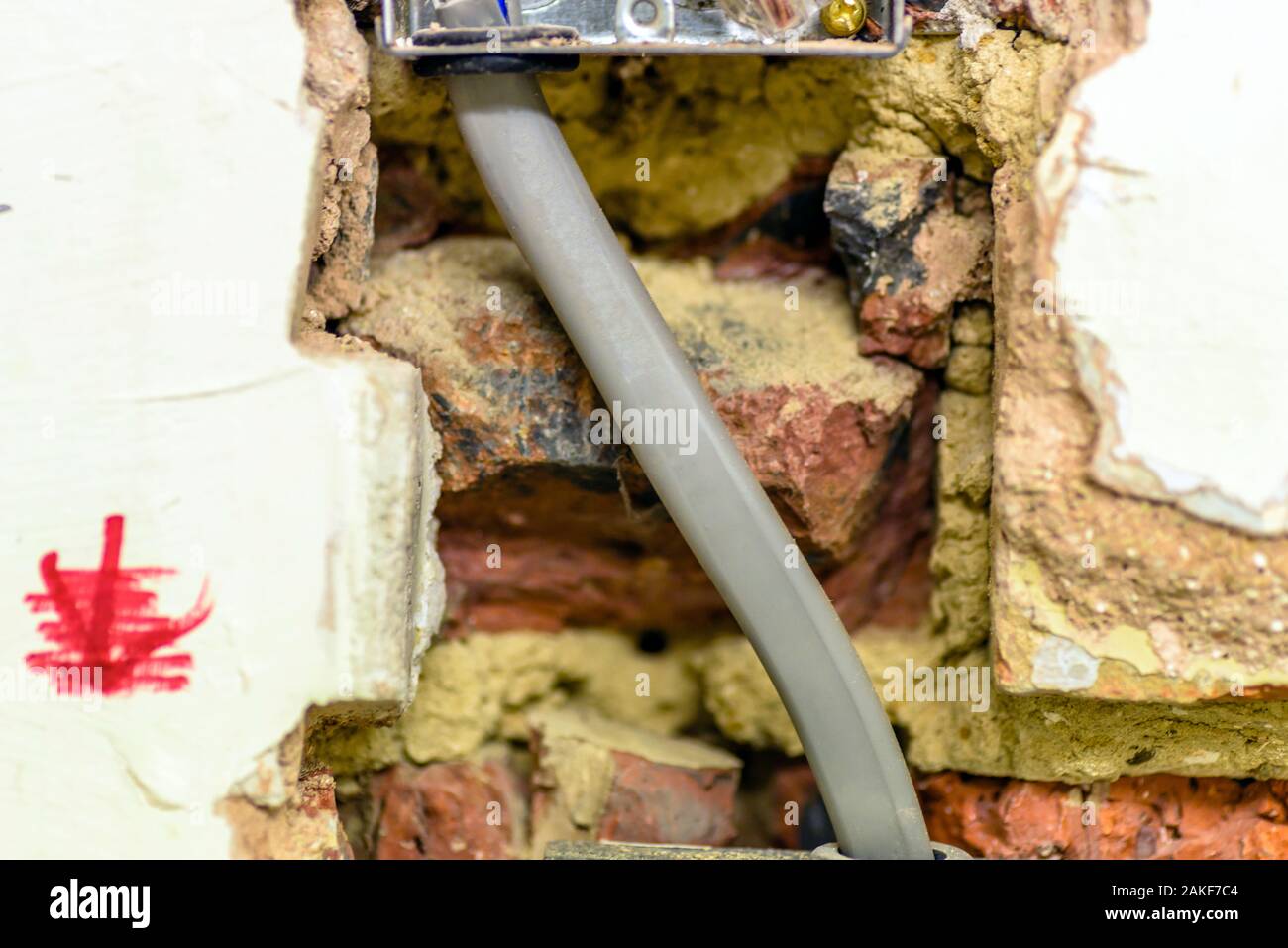 electric wires in a wall during renovation in england uk Stock Photo ...