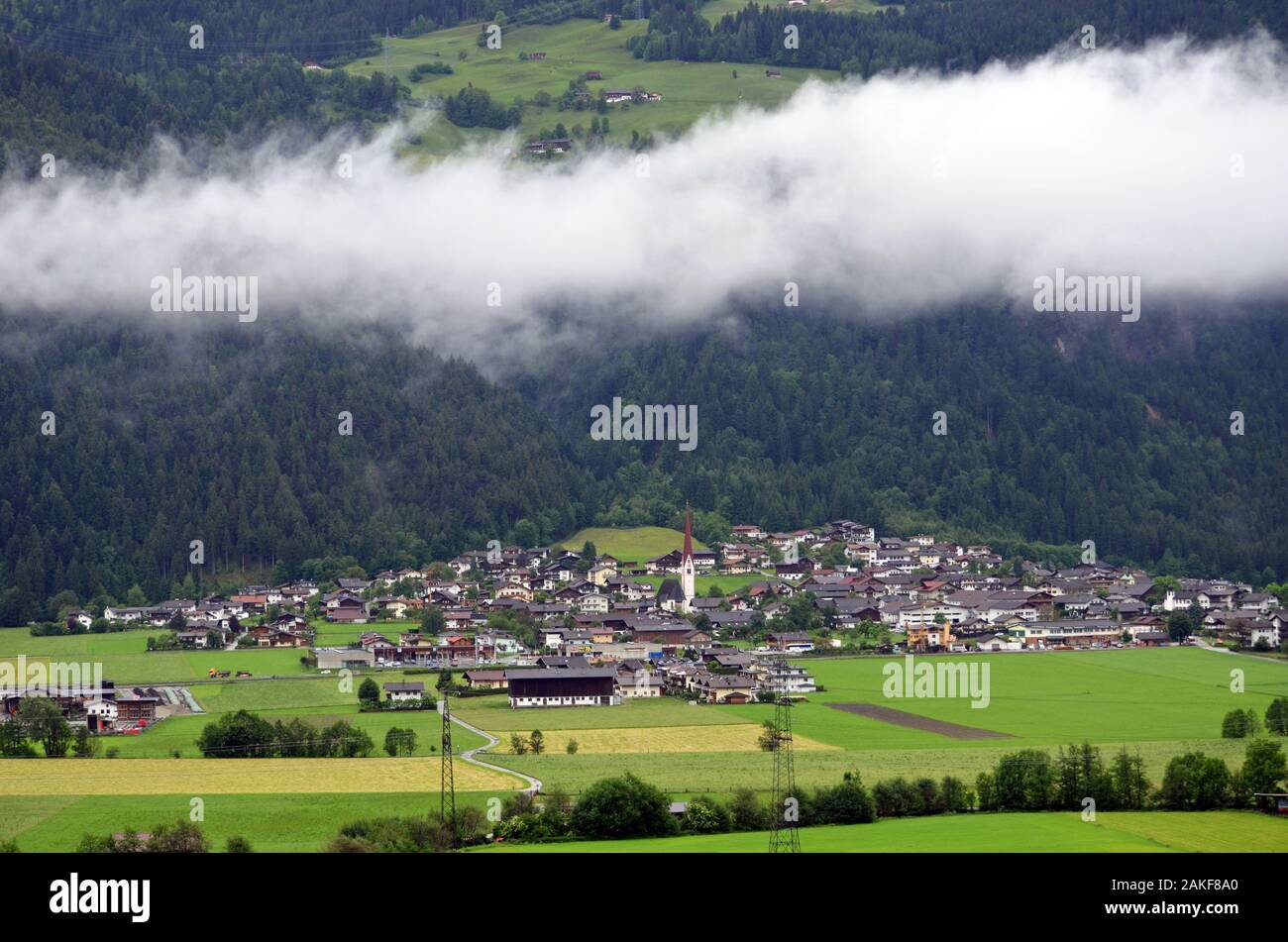 Austria europe mountain landscape with village and natural scene grass ...