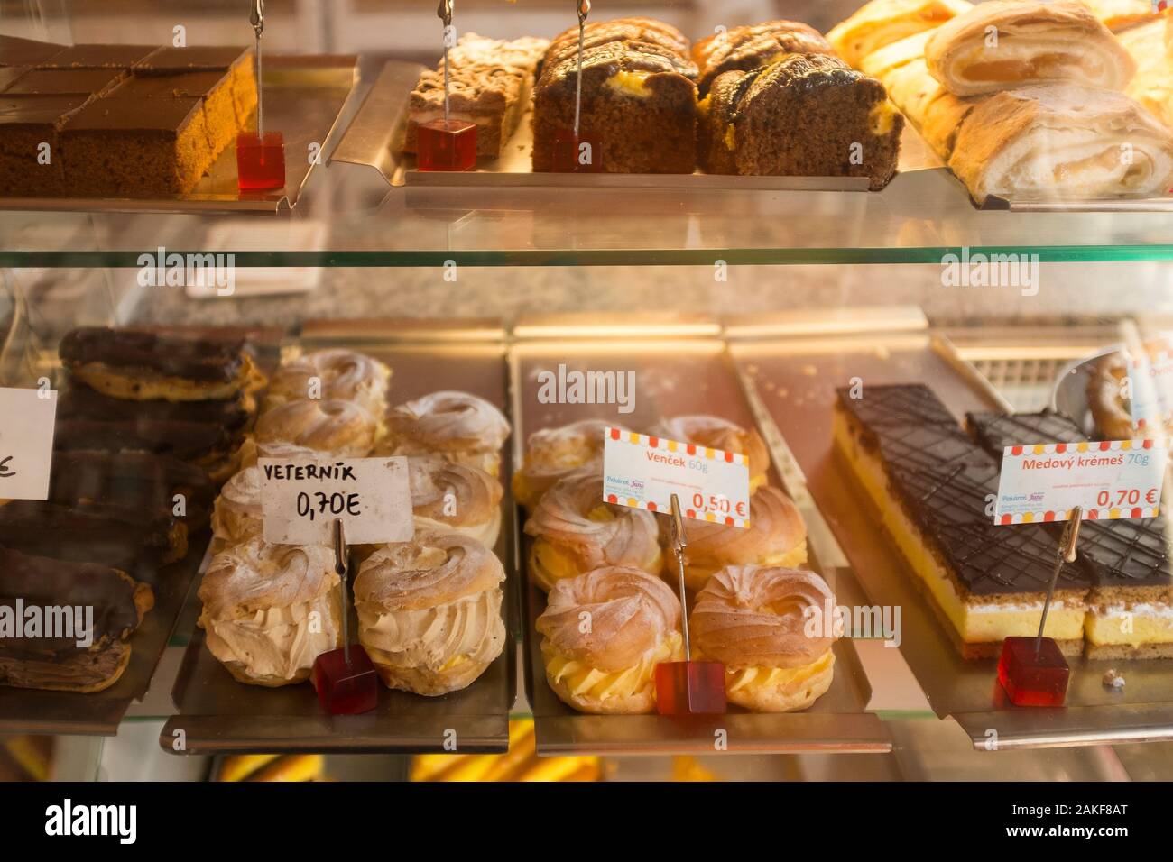 A selection of cakes on display at a local bakery in Kosice, Slovakia ...