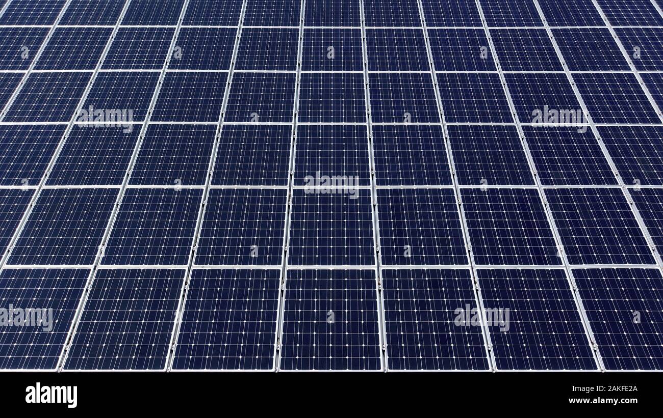 Blue solar cells with white border Stock Photo - Alamy