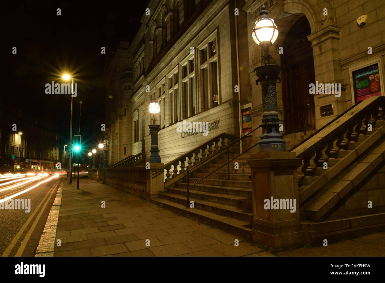 Lantern style street lamps and Central Library, Aberdeen, at night-time ...