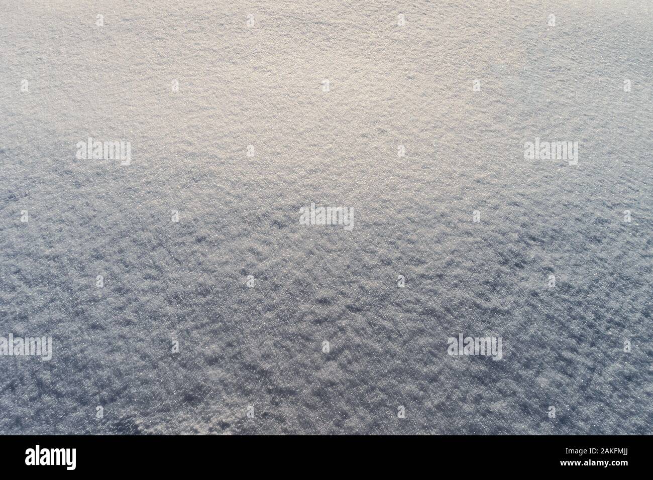 Snow texture at sunny winter day. Abstract background with shadows and ...