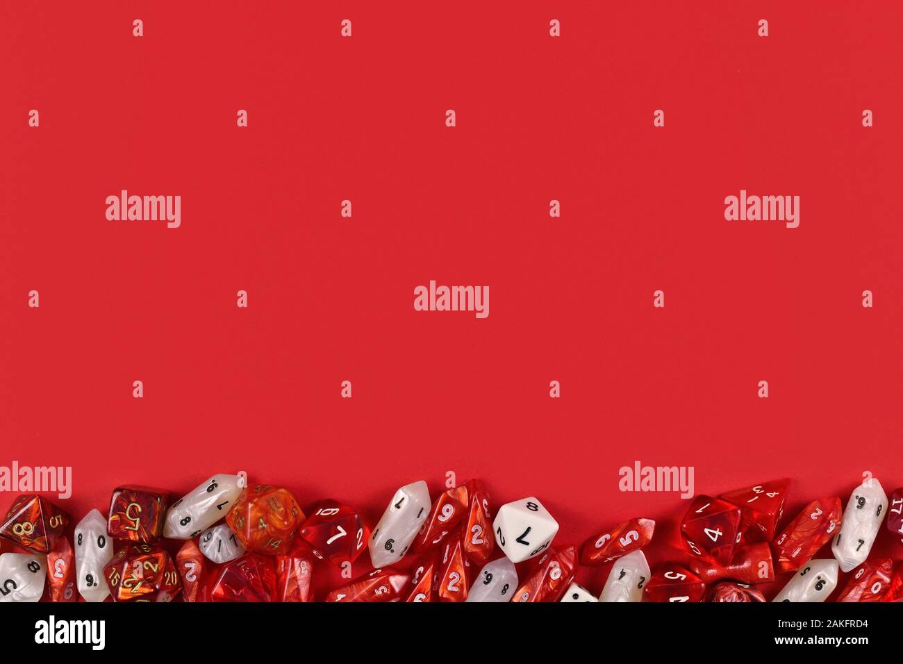 Background with different roleplaying RPG dice at bottom of red ...