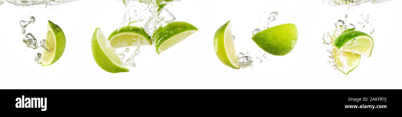Fresh lime dropped into water with splash isolated on white Stock Photo ...