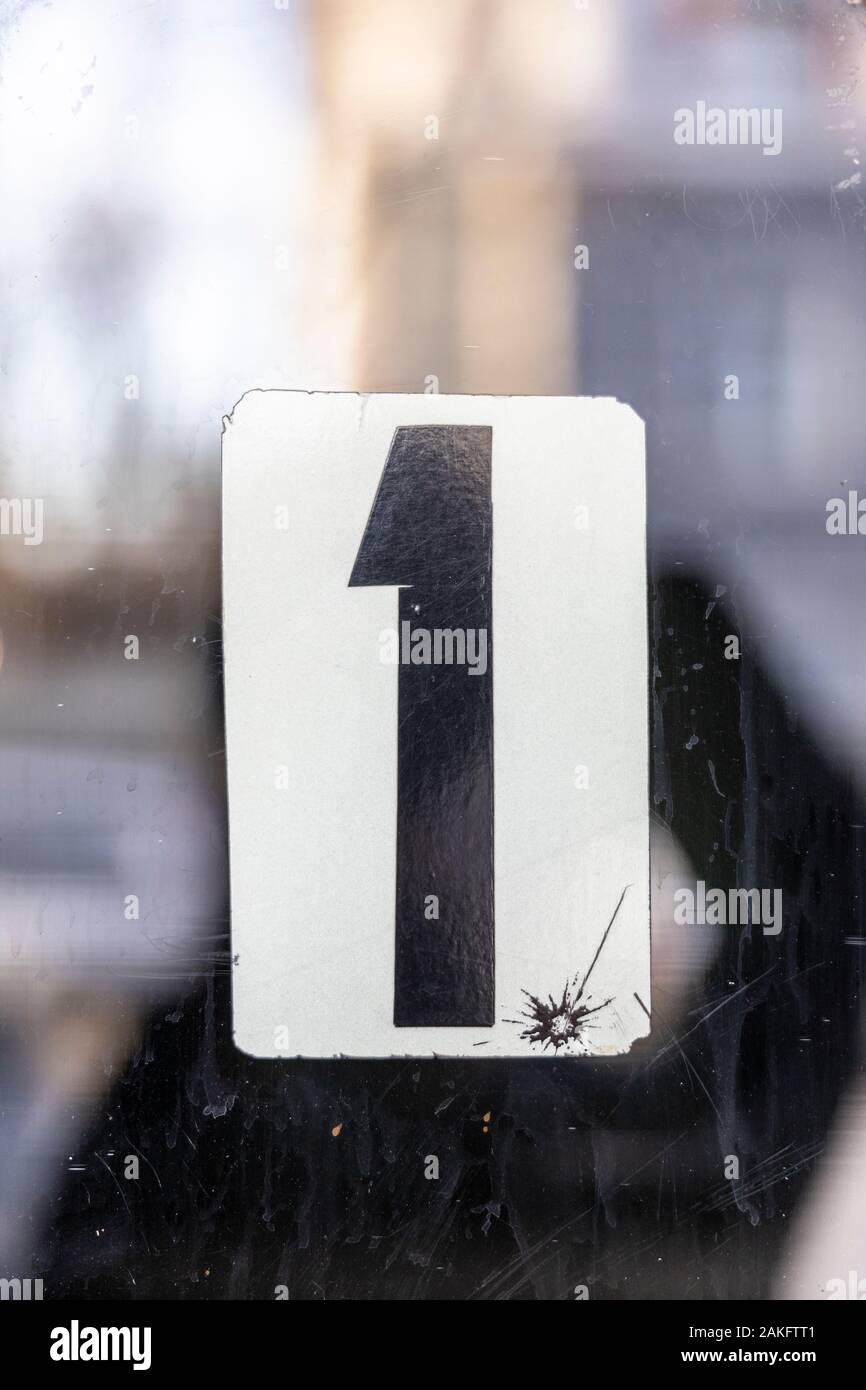 Number 1, one, street number sign on the wall Stock Photo - Alamy