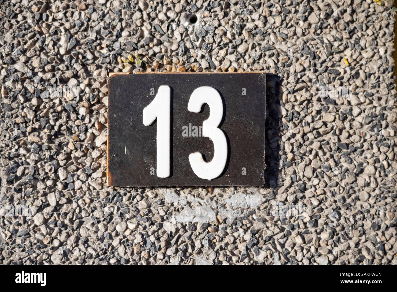 Number 13, thirteen, street number sign on the wall Stock Photo - Alamy
