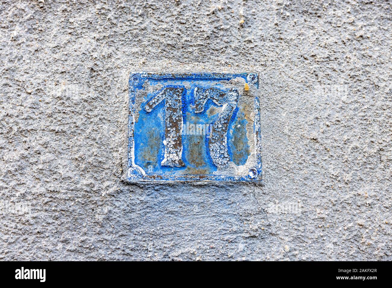 Number 17, seventeen, street number sign on the wall Stock Photo - Alamy