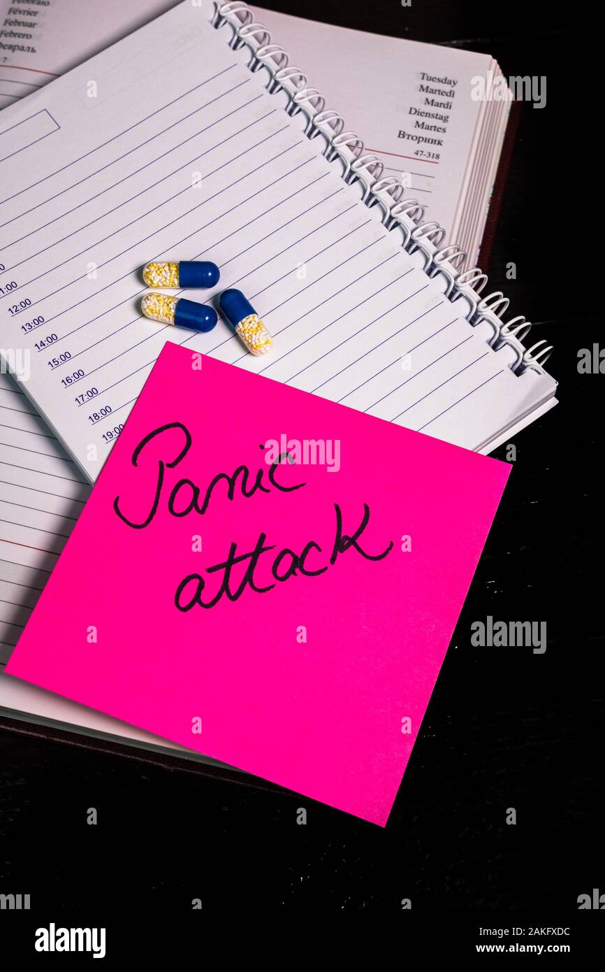 Writing Panic attack on memo post reminder. Text Panic attack on sticky ...